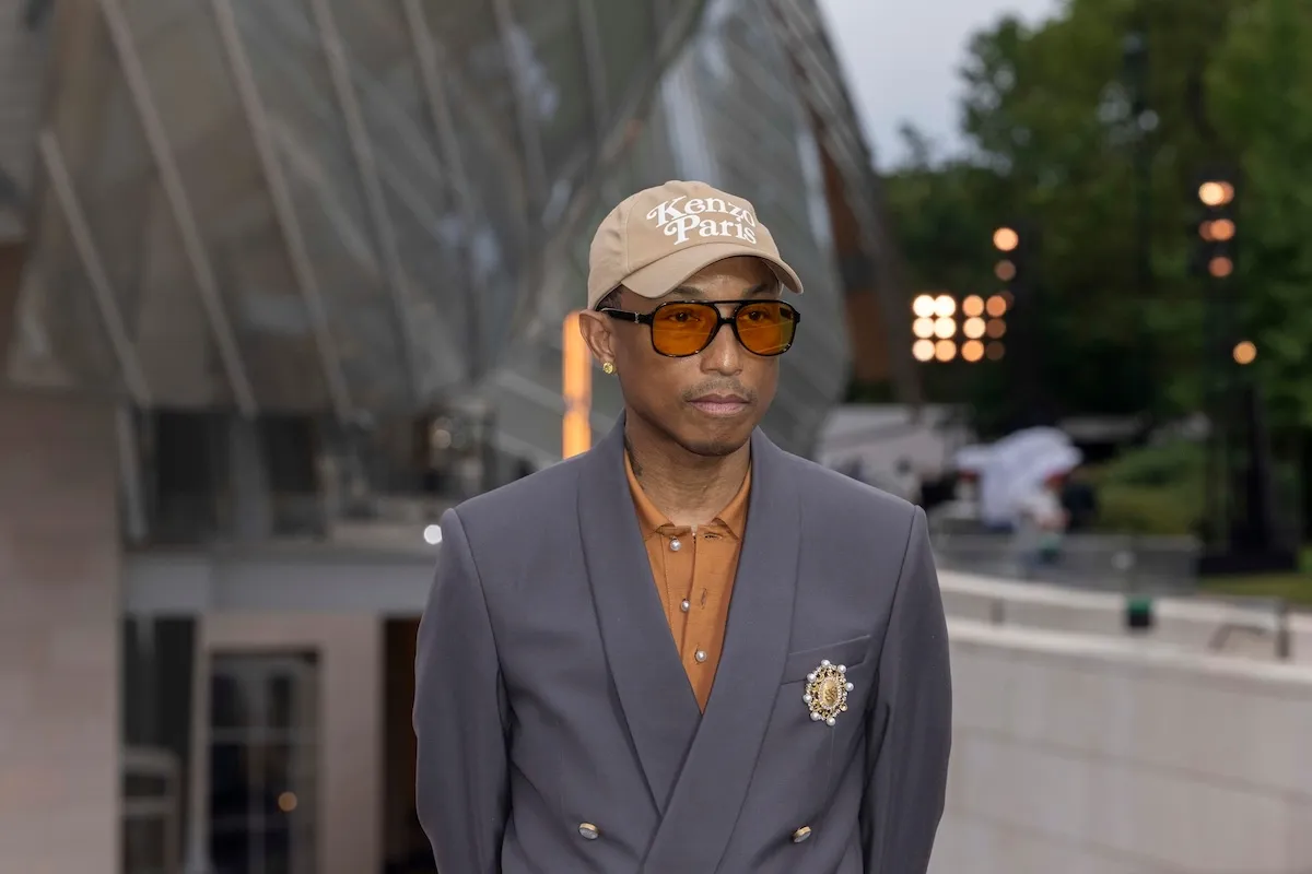 Pharrell Williams Shows Off New Louis Vuitton Man Purse at Olympics